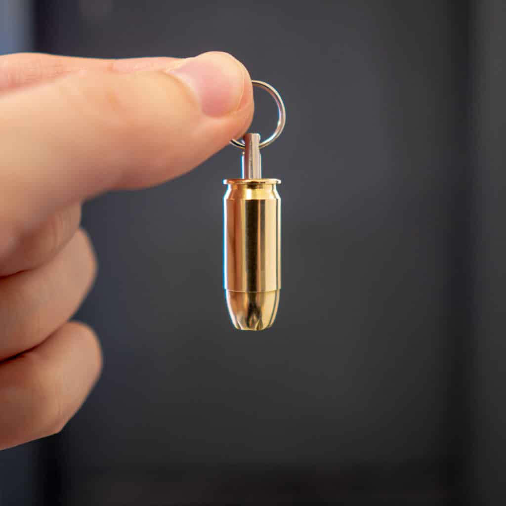 .45 ACP Patrone als Anhänger mit Defence Geschoss